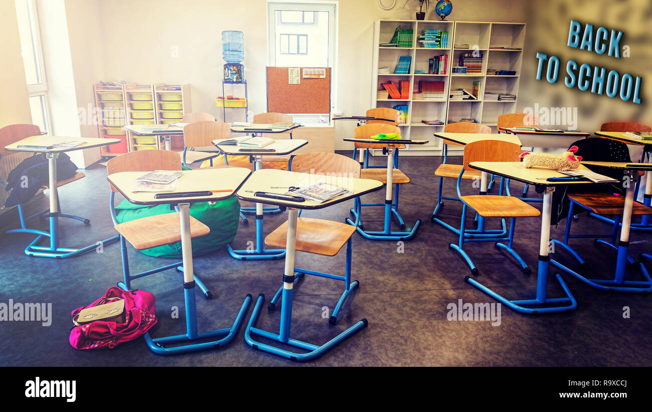 Interior of classroom in the modern school. School board, desks ...