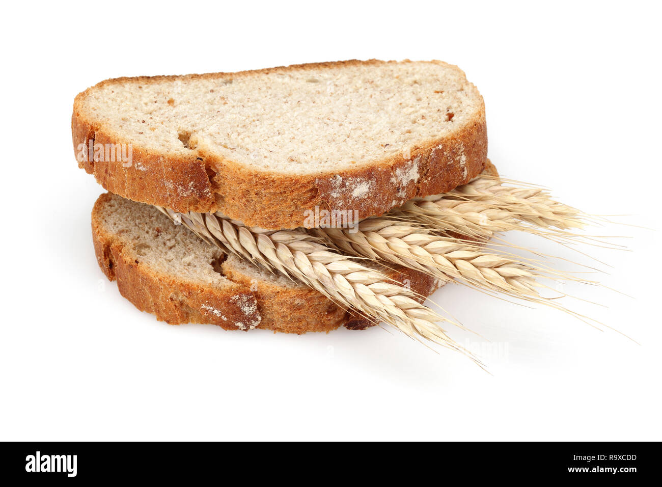 Bread slices with wheat ears in between isolated on white background ...