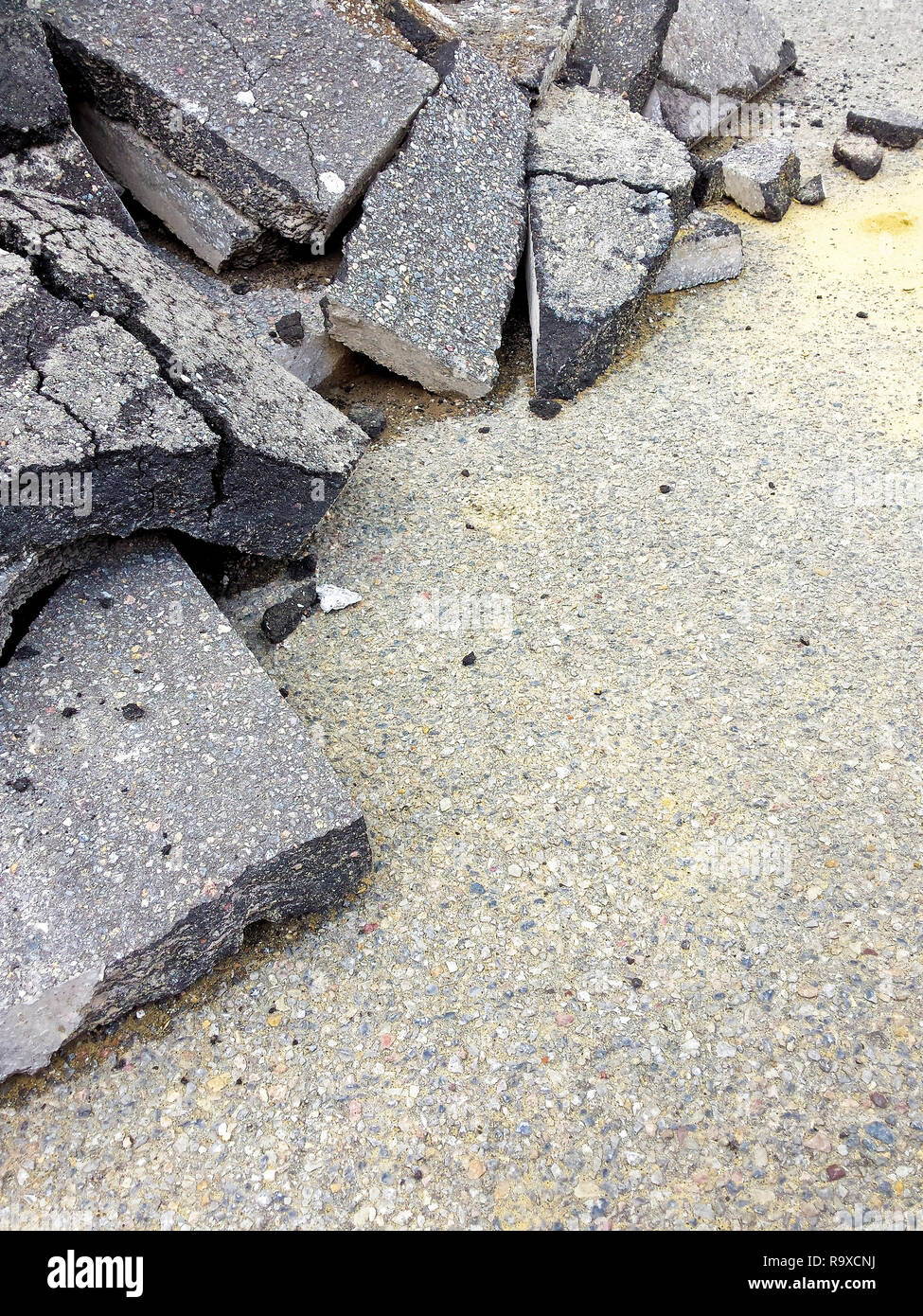 Cracked asphalt pieces background - concept image Stock Photo - Alamy