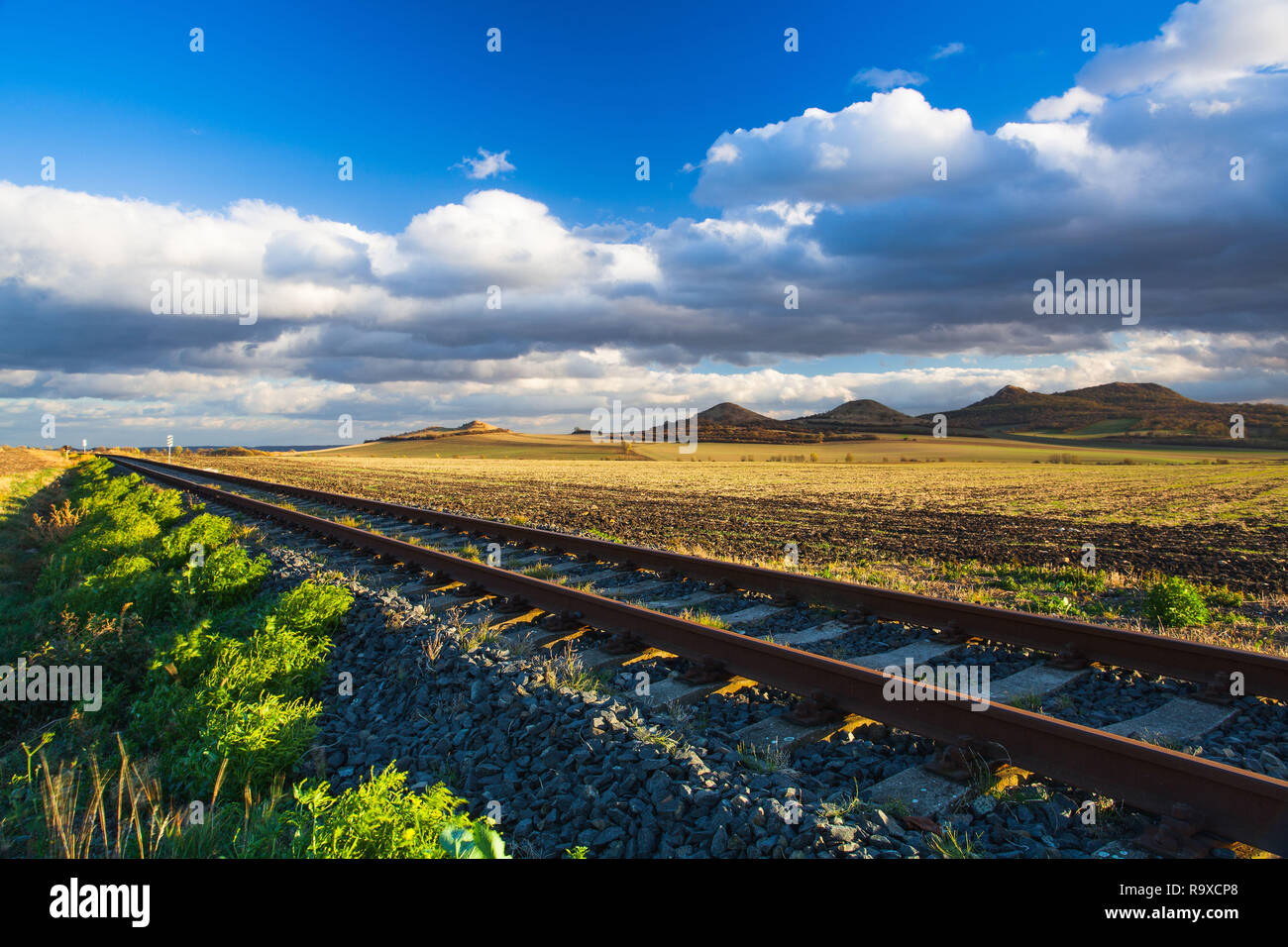 Single railway track at sunset, Central Bohemian Uplands, Czech ...