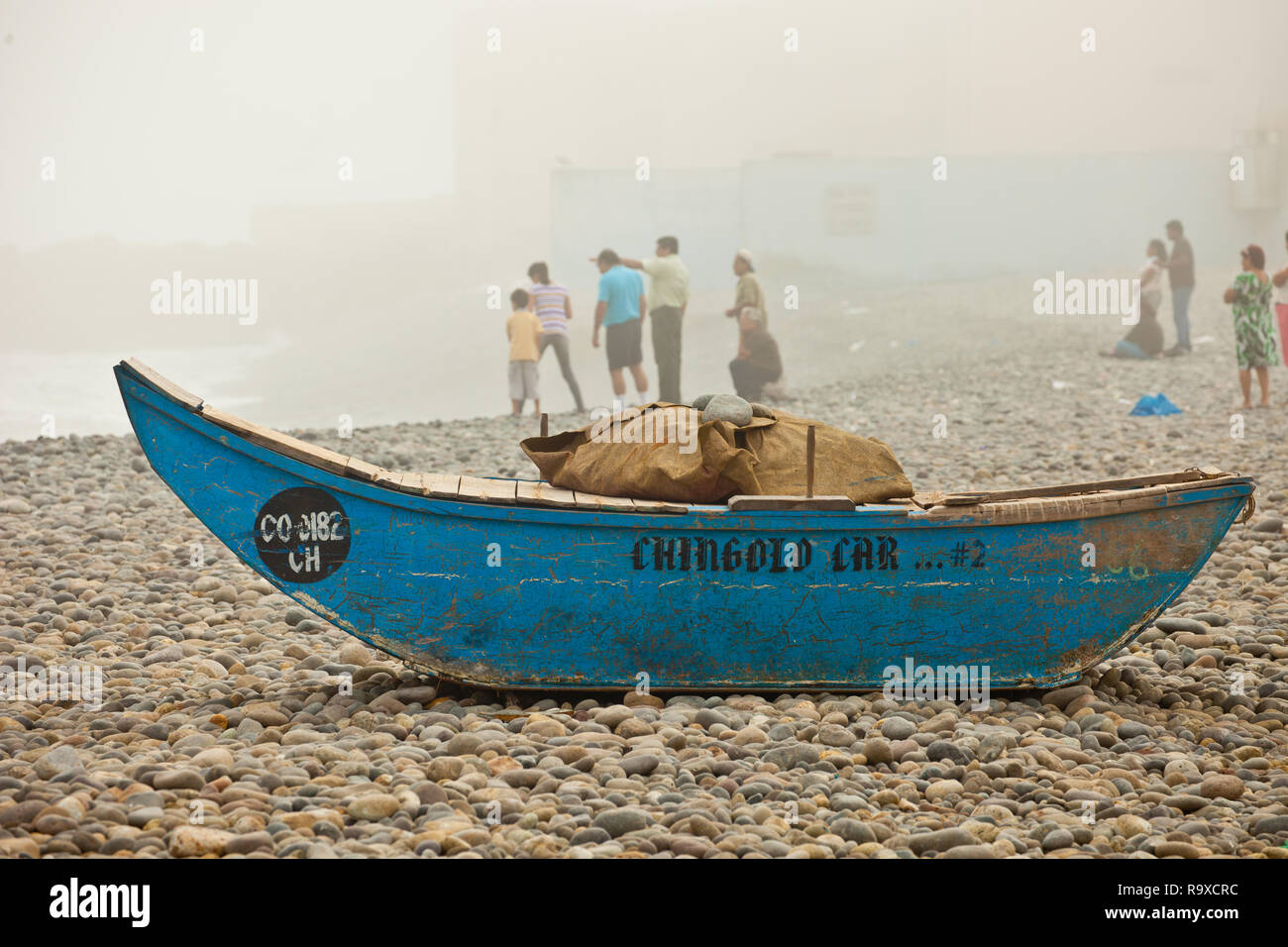 People throwing rocks to the sea of Lima,in Peru while a traditional ...
