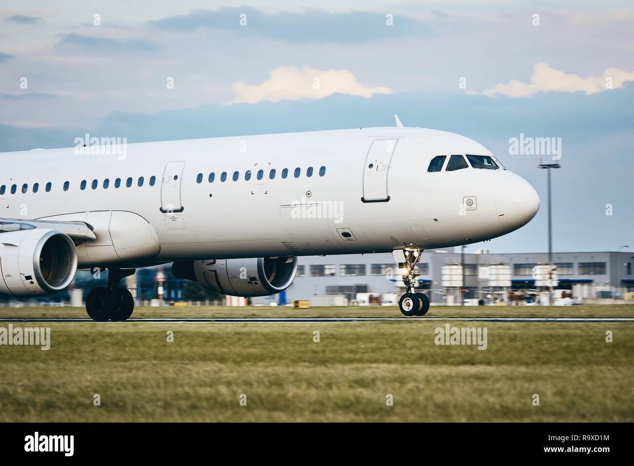 Traffic at the airport. Airplane landing on the runway Stock Photo - Alamy