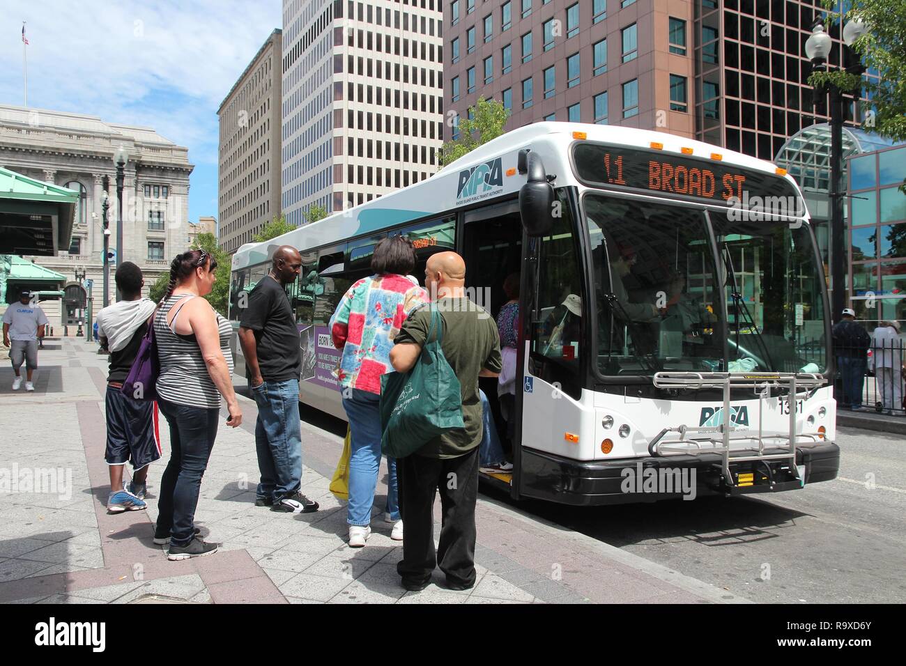 PROVIDENCE, USA - JUNE 8, 2013: People board city bus in Providence ...