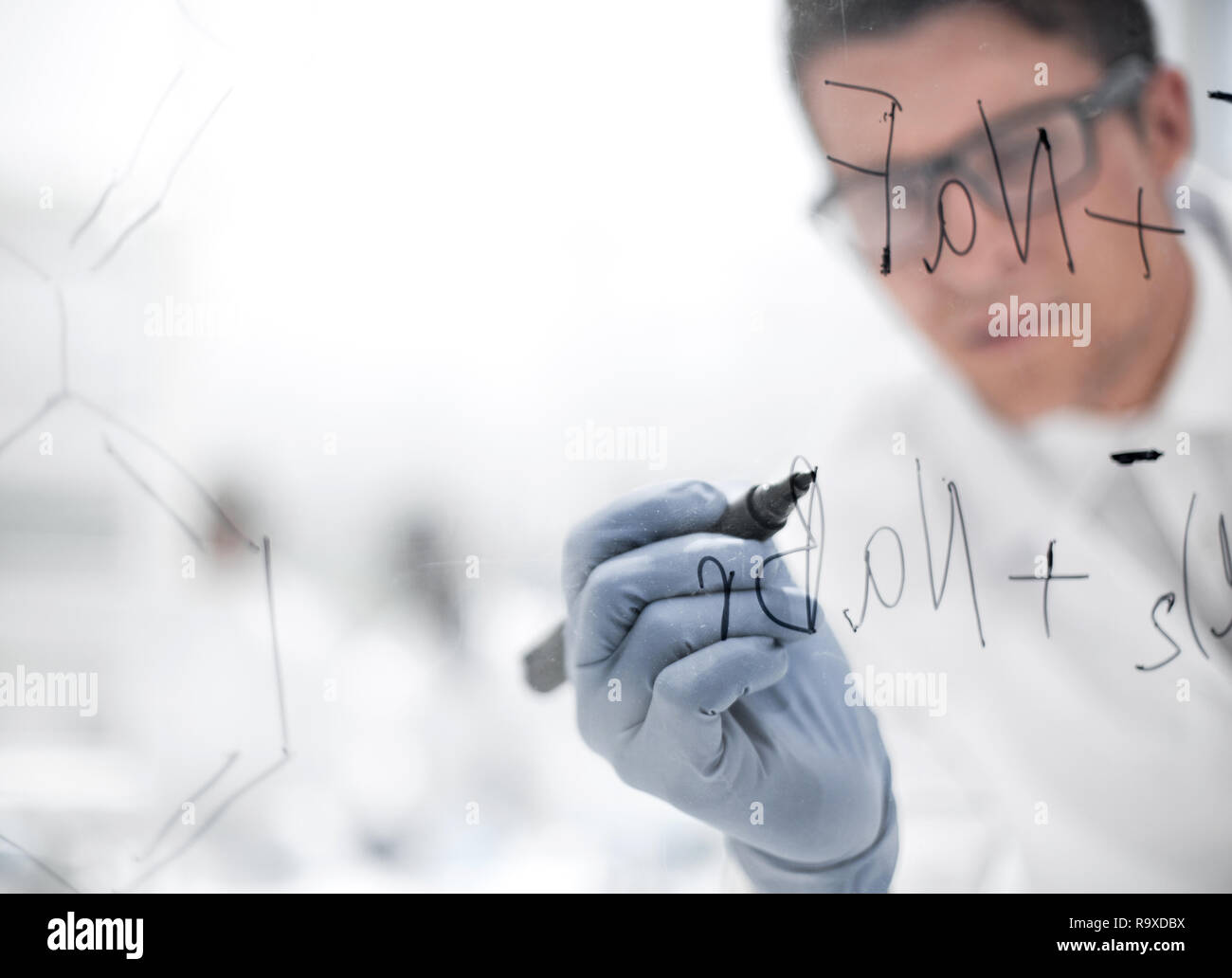close up.a focused scientist makes notes on the Board Stock Photo - Alamy