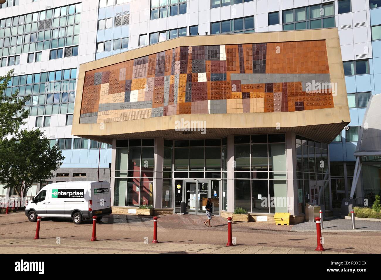 BRADFORD, UK - JULY 11, 2016: Person exits Richmond Building at the ...