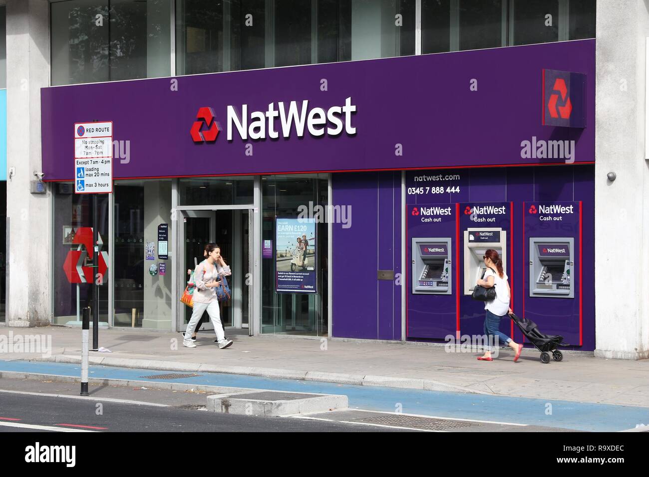 LONDON, UK - JULY 6, 2016: People walk by NatWest bank branch in London ...