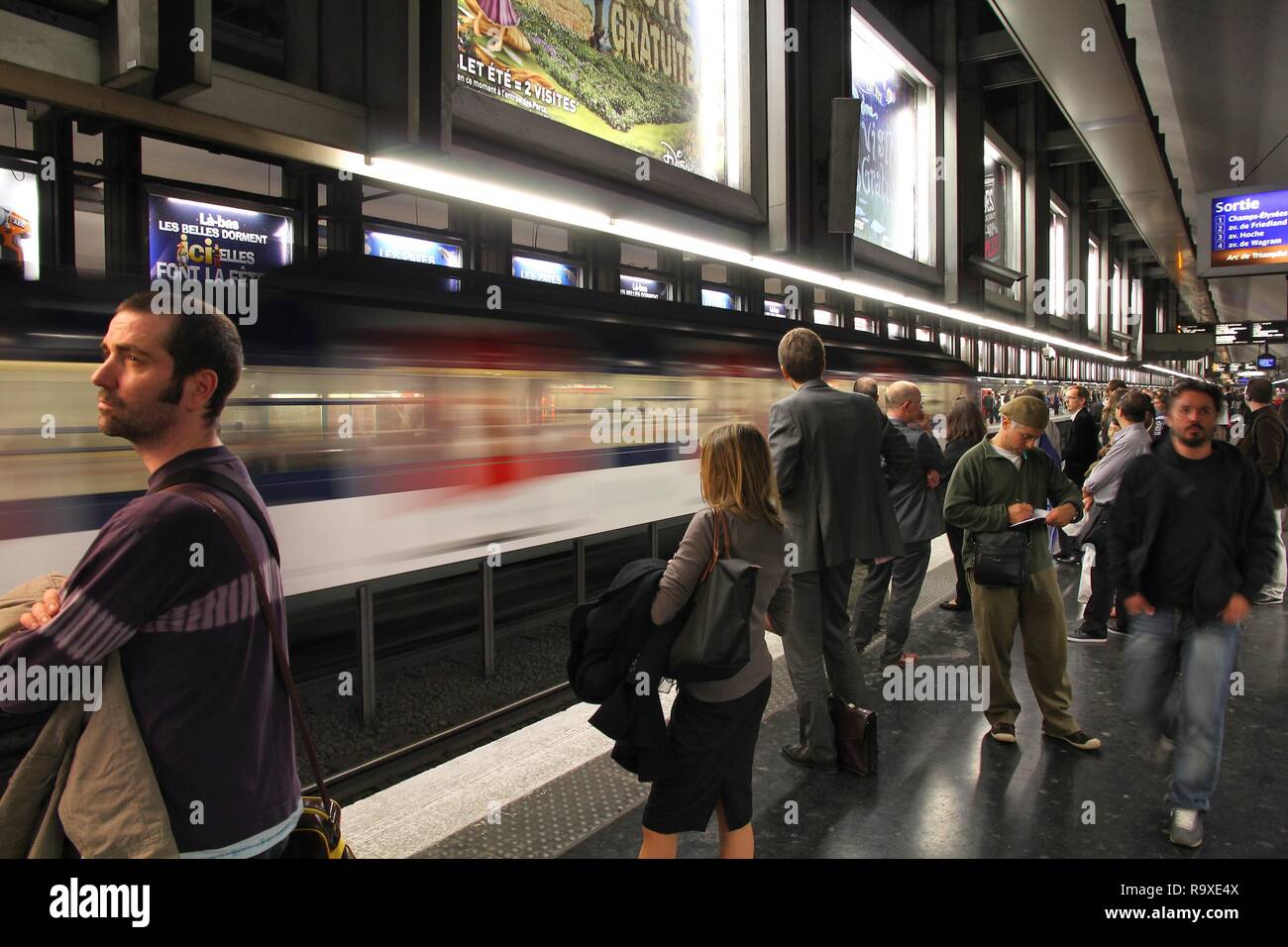 PARIS - JULY 20: People wait at Paris Metro station on July 20, 2011 in ...