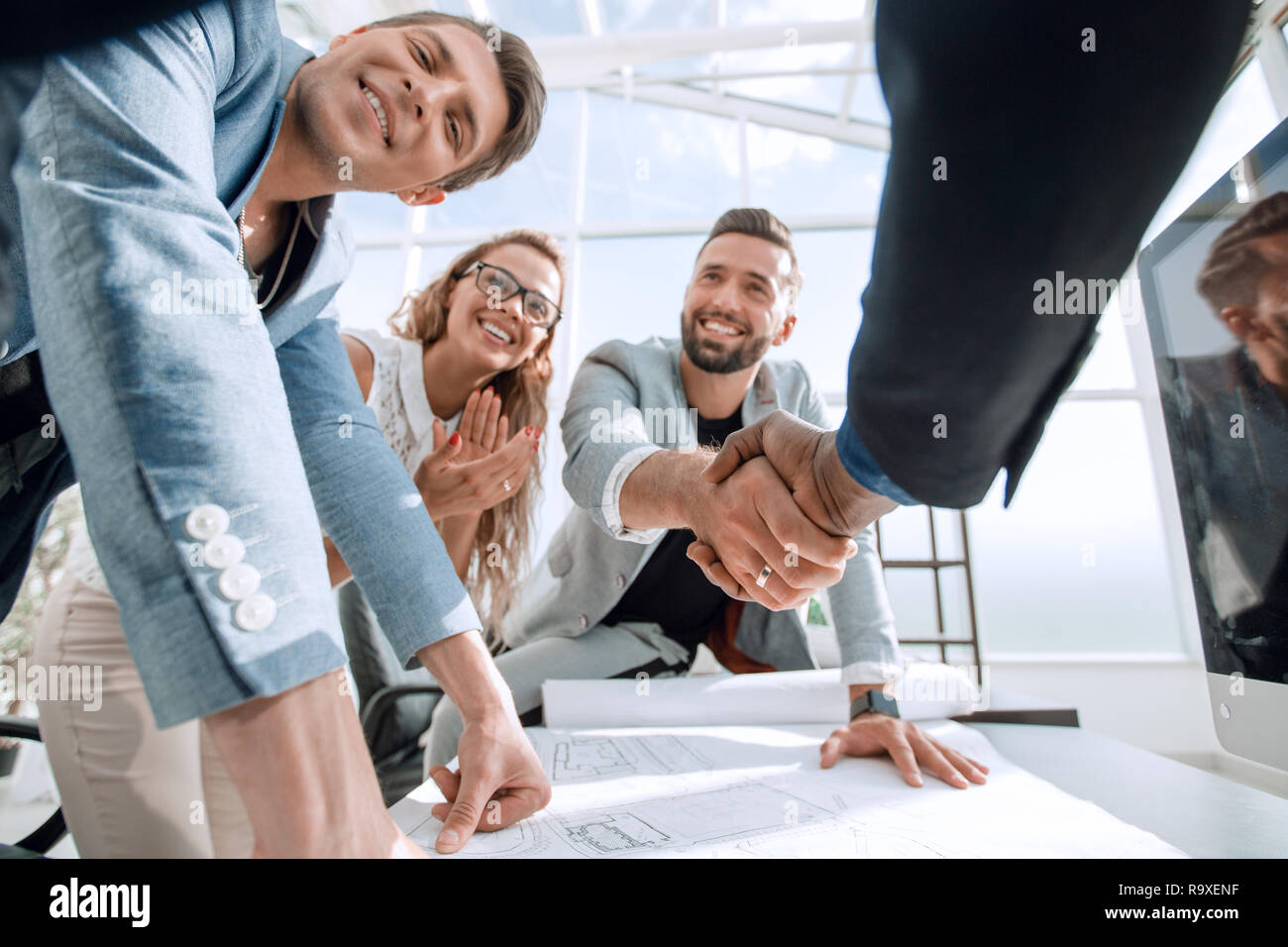 close up.businessman and architect shaking hands Stock Photo - Alamy