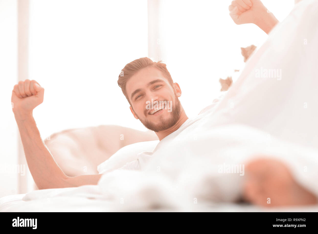 closeup.happy man resting in the bedroom Stock Photo - Alamy