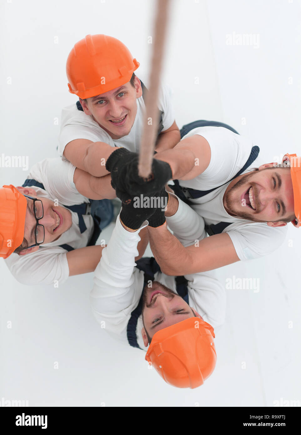 view from the top.a group of workers pulling a rope Stock Photo - Alamy