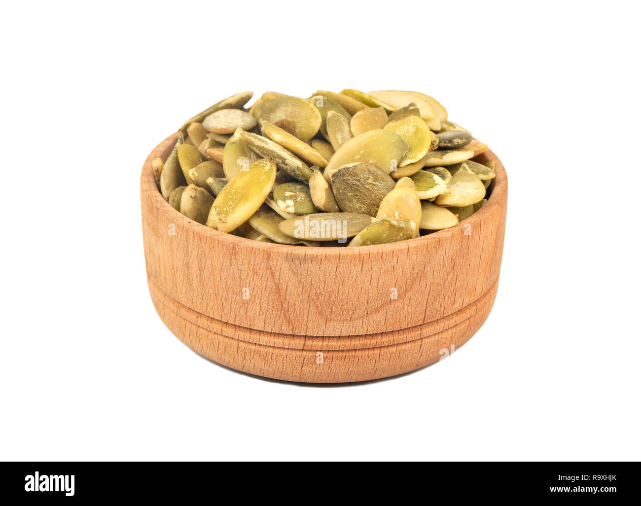 Pumpkin seed kernels in bowl on white background Stock Photo - Alamy