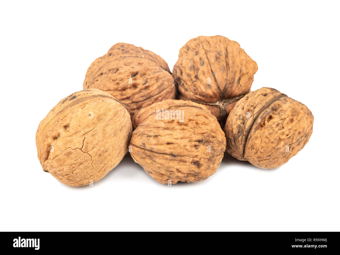 Large pile of raw walnuts on a white background Stock Photo - Alamy