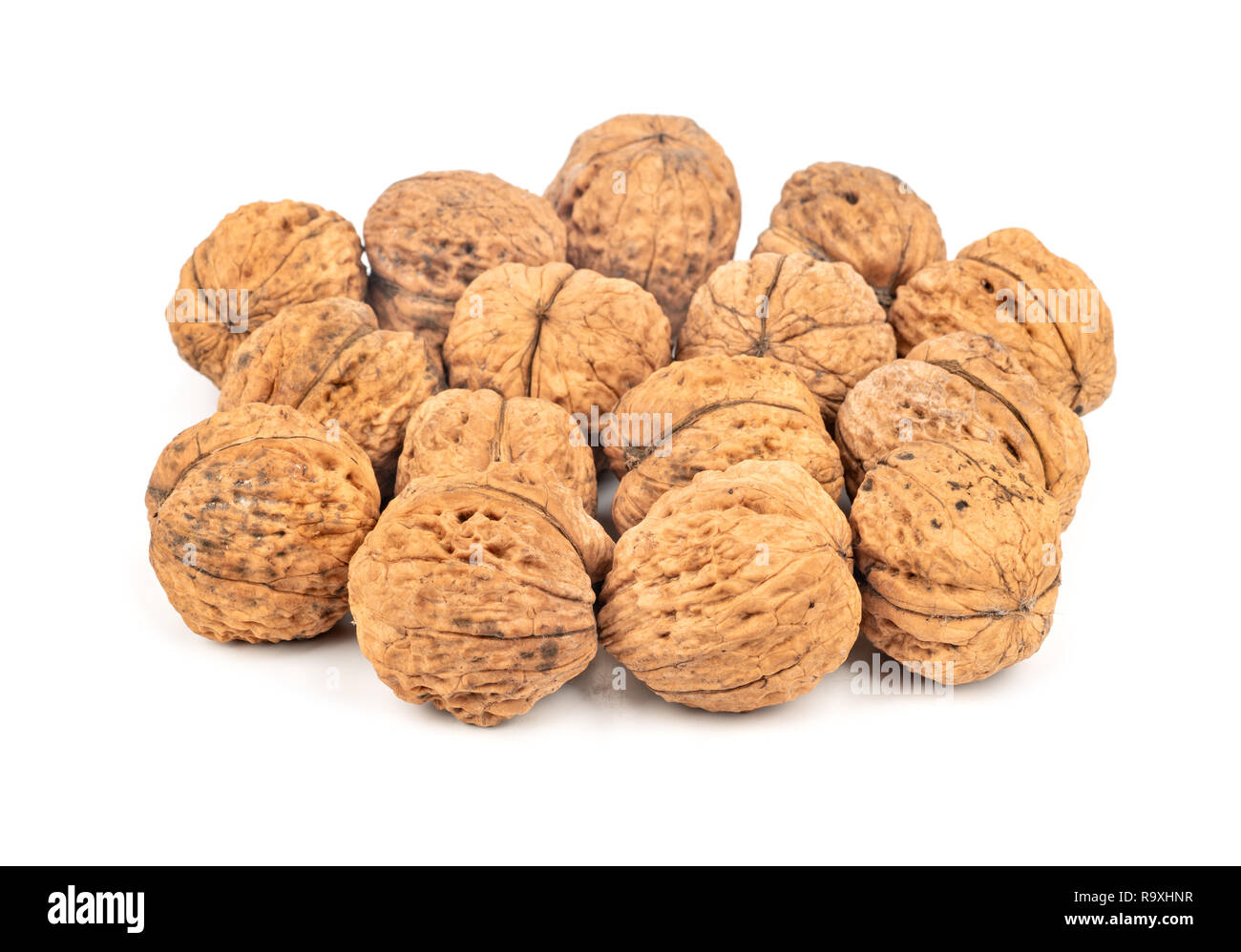 Pile of dry walnuts isolated on white background Stock Photo - Alamy