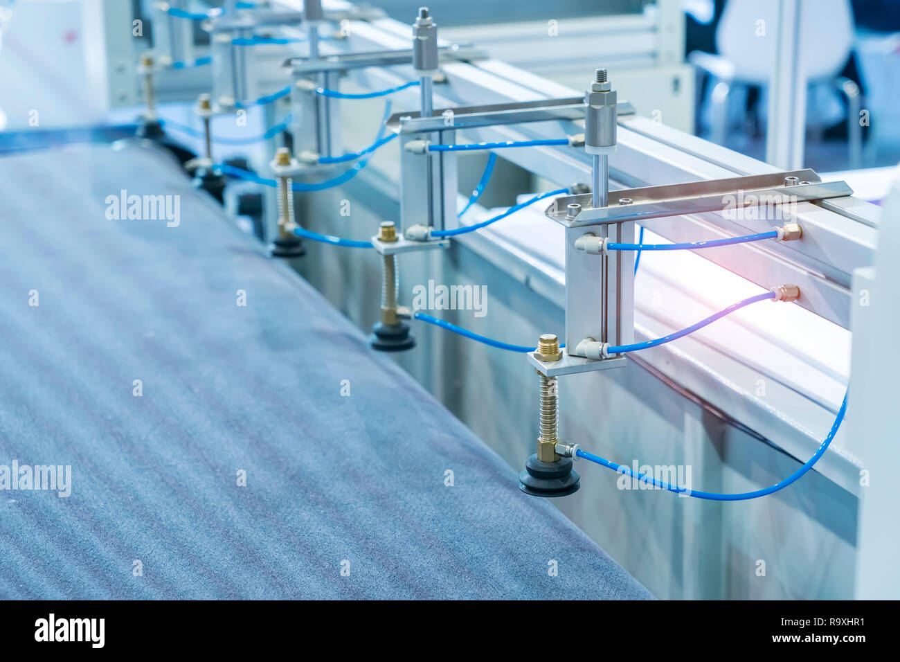 robotic and pneumatic piston sucker unit on industrial machine ...