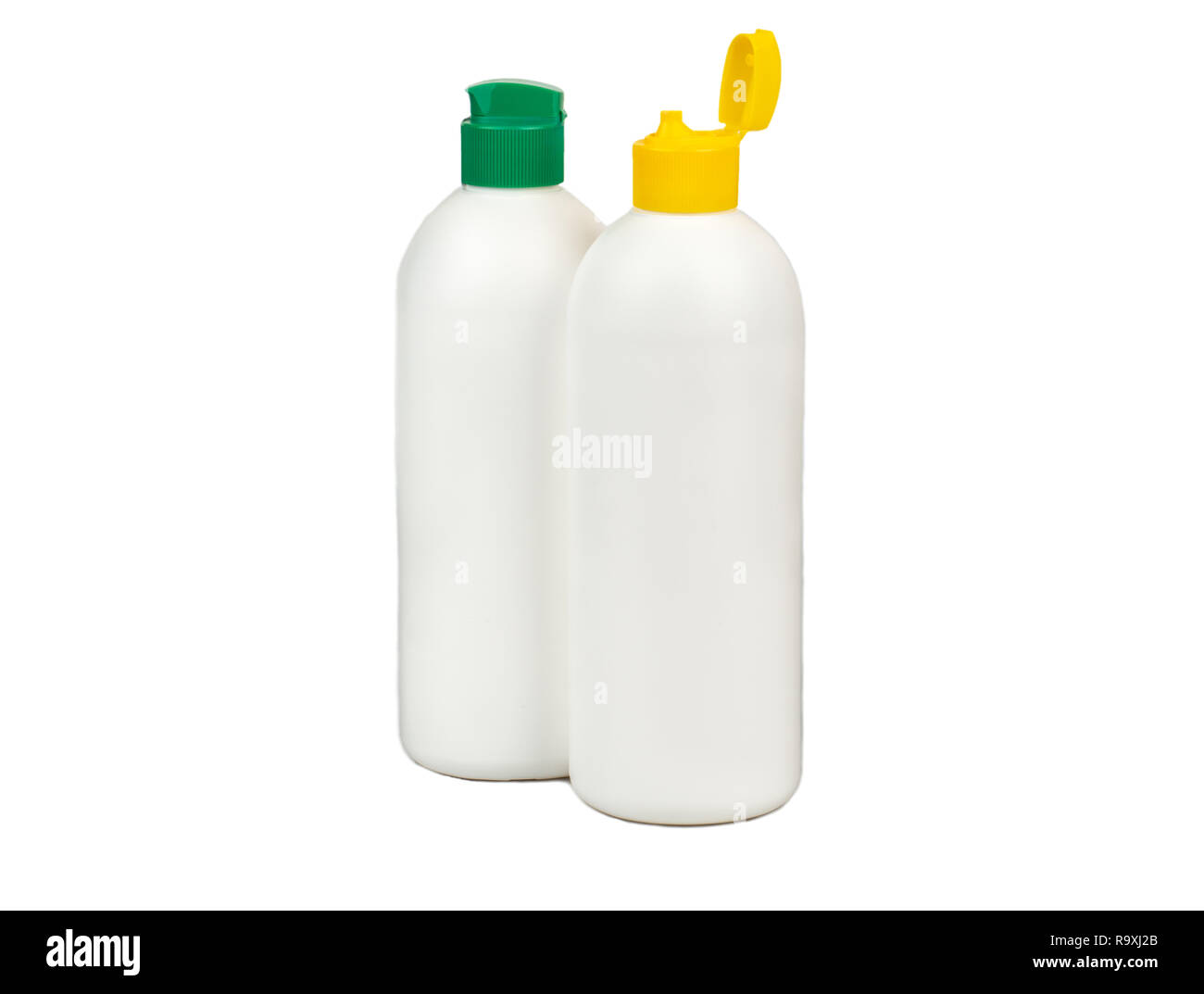 Two empty liquid bottles isolated on white background Stock Photo - Alamy