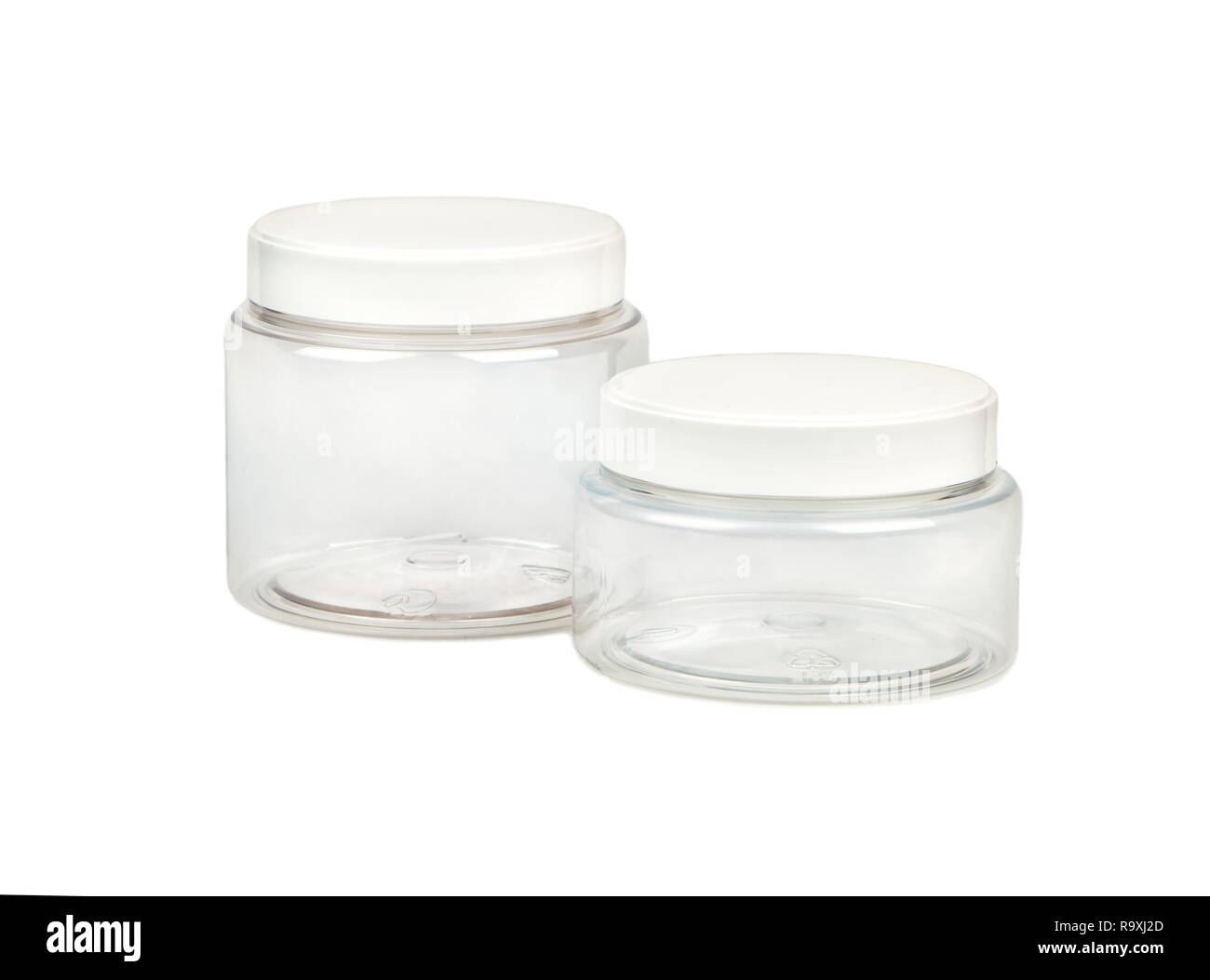 Two glass jars for cosmetics on white background Stock Photo - Alamy