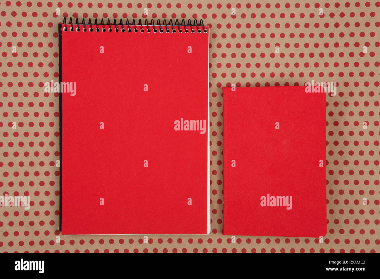 Education Concept and desk accessories - two red notepads on craft ...