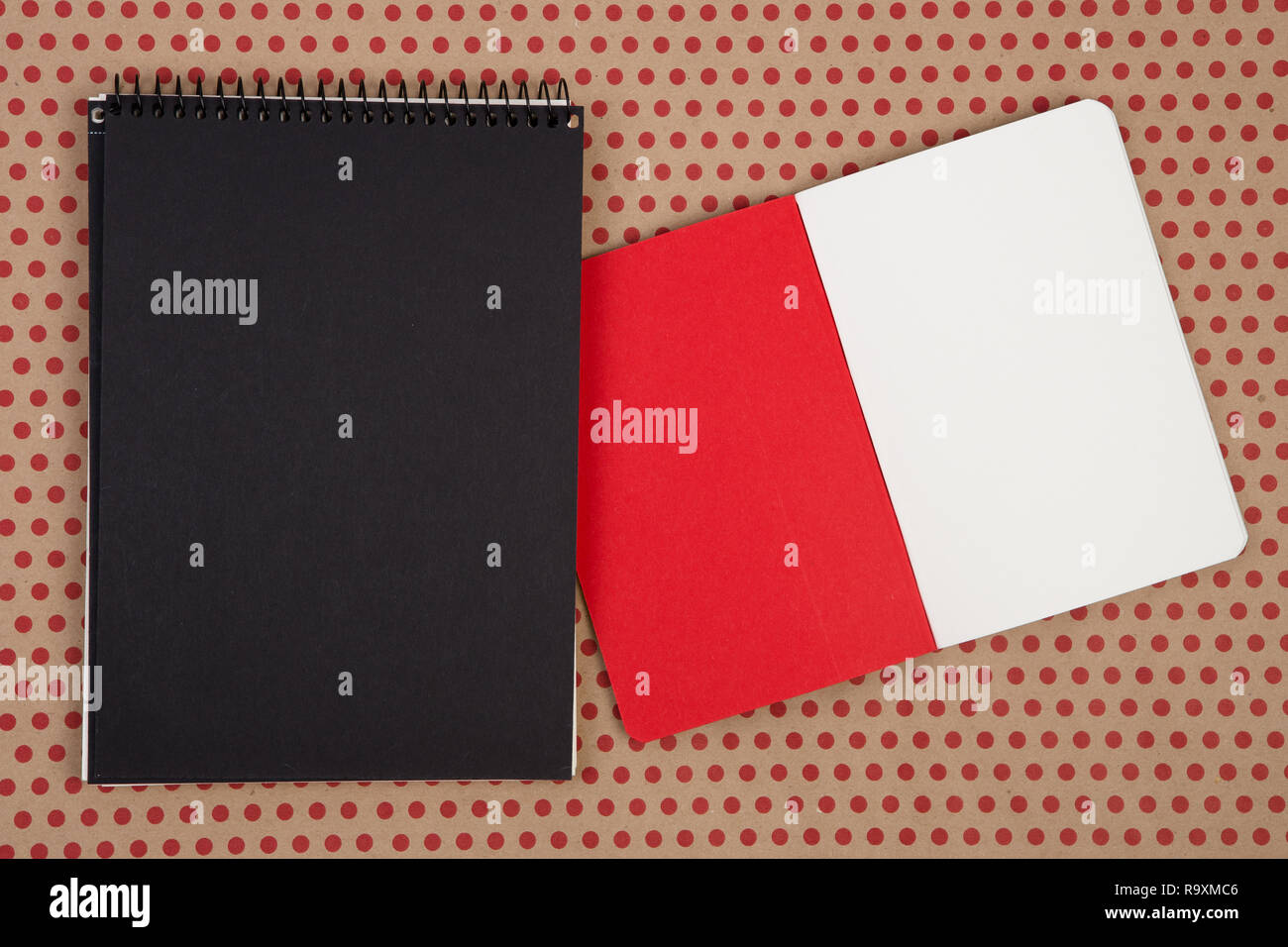 Education Concept and desk accessories - red and black notepads on ...