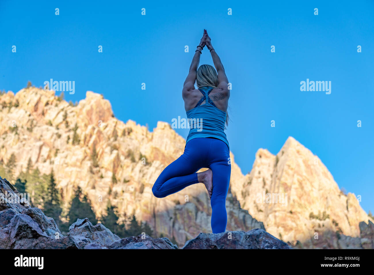 Woman doing yoga warrior hi-res stock photography and images - Alamy