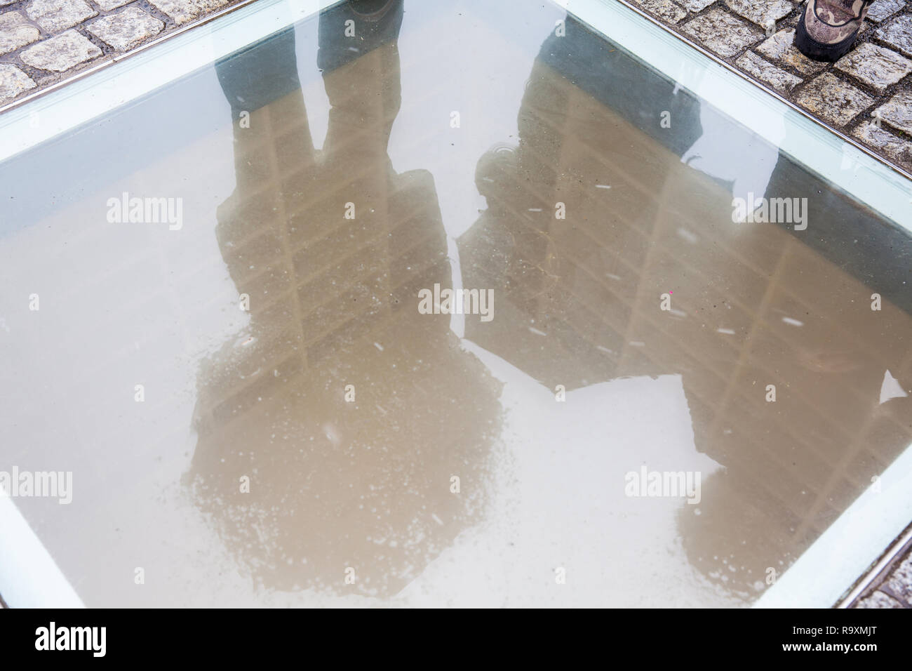 BERLIN, GERMANY - MARCH, 2018: Tourists looking at the memorial of the ...