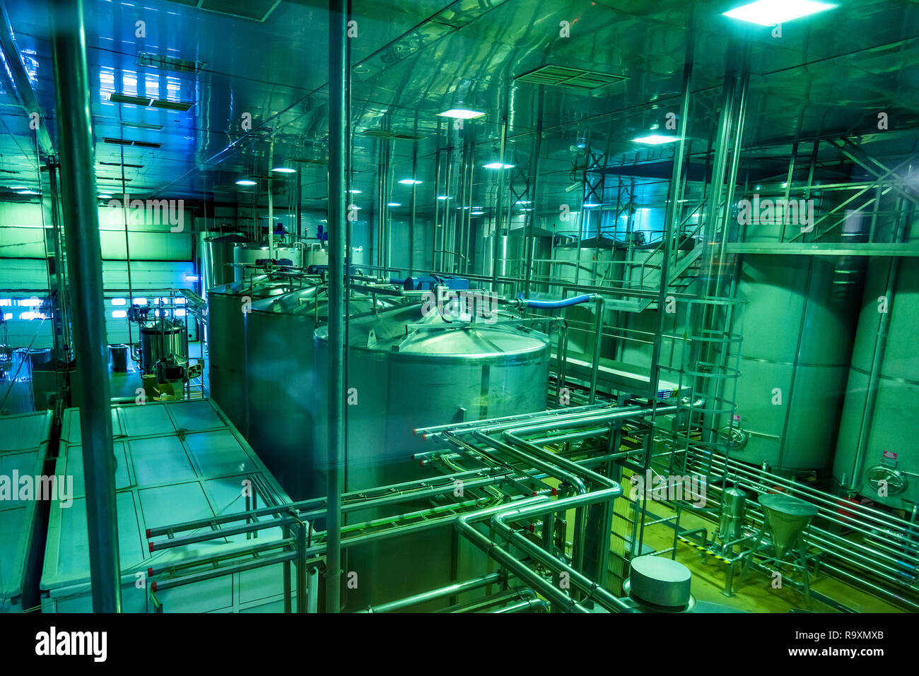 View of tubes and appliances at soft drinks factory Stock Photo - Alamy
