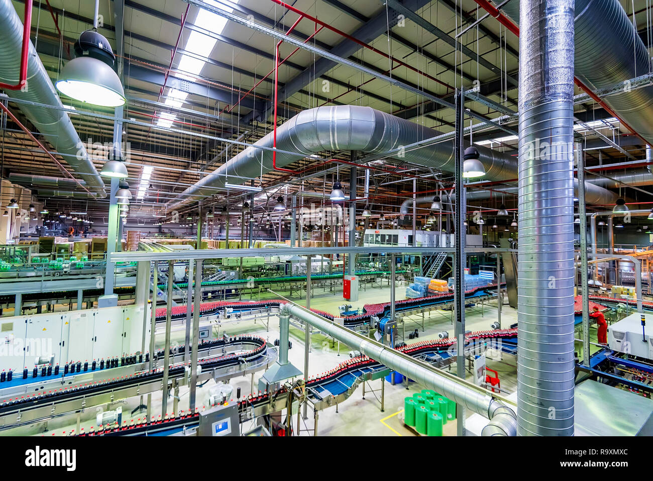 View of tubes and appliances at soft drinks factory Stock Photo - Alamy