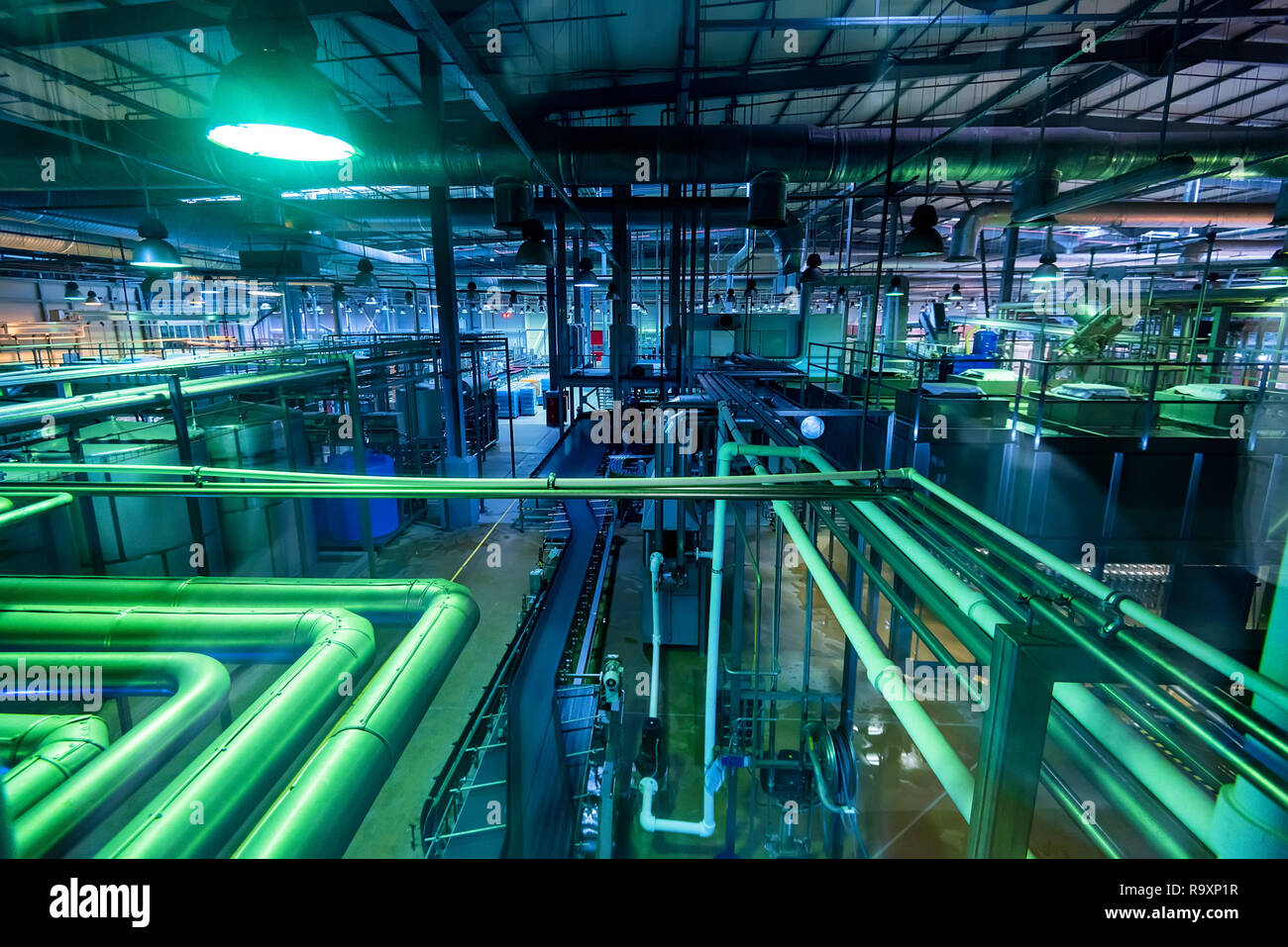 View of tubes and appliances at soft drinks factory Stock Photo - Alamy