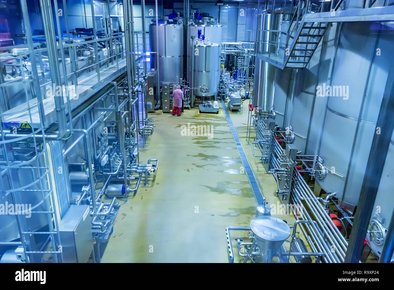 View of tubes and appliances at soft drinks factory Stock Photo - Alamy