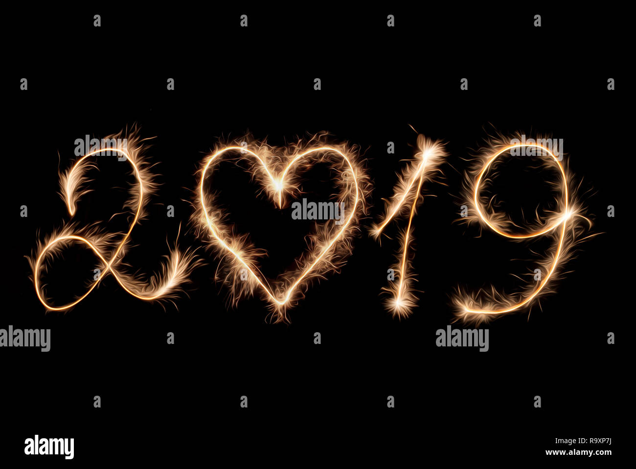 2019 numbers written by sparklers on black background Stock Photo - Alamy