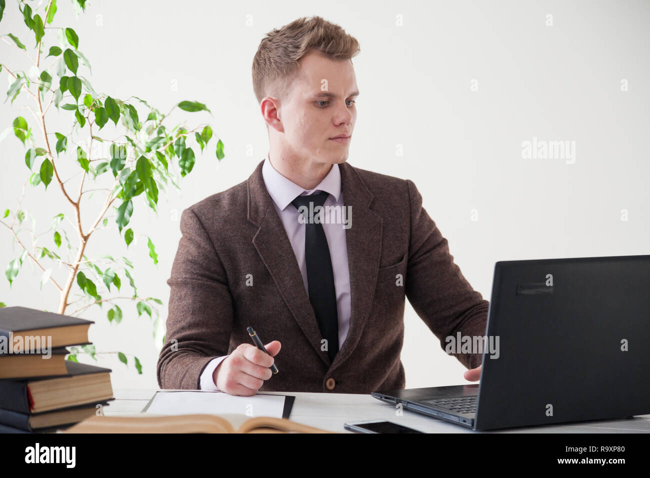 a man works in the Office at the computer business clerk Stock Photo ...