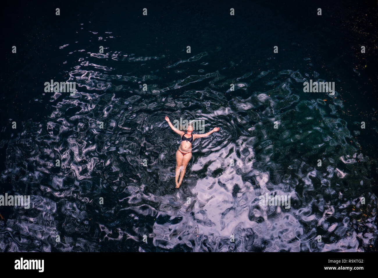 Woman Floating in Cenote, Mexico Stock Photo - Alamy