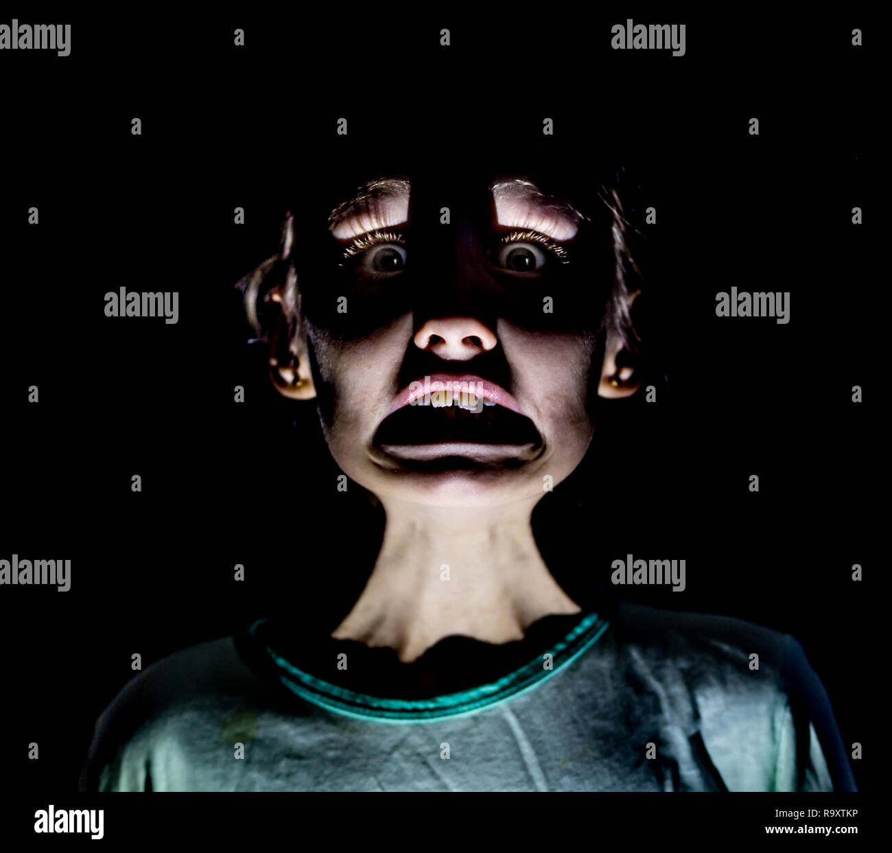 Portrait of scared young caucasian girl. Scary and fear concept. Low ...