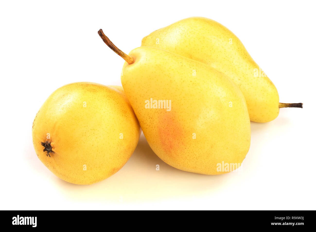 Three ripe yellow pear fruits isolated on white background. Top view ...