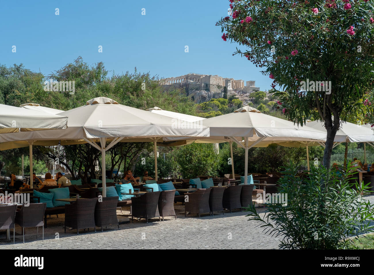 Terrace of an outside bar cafe restaurant in Athens, Greece with a view ...