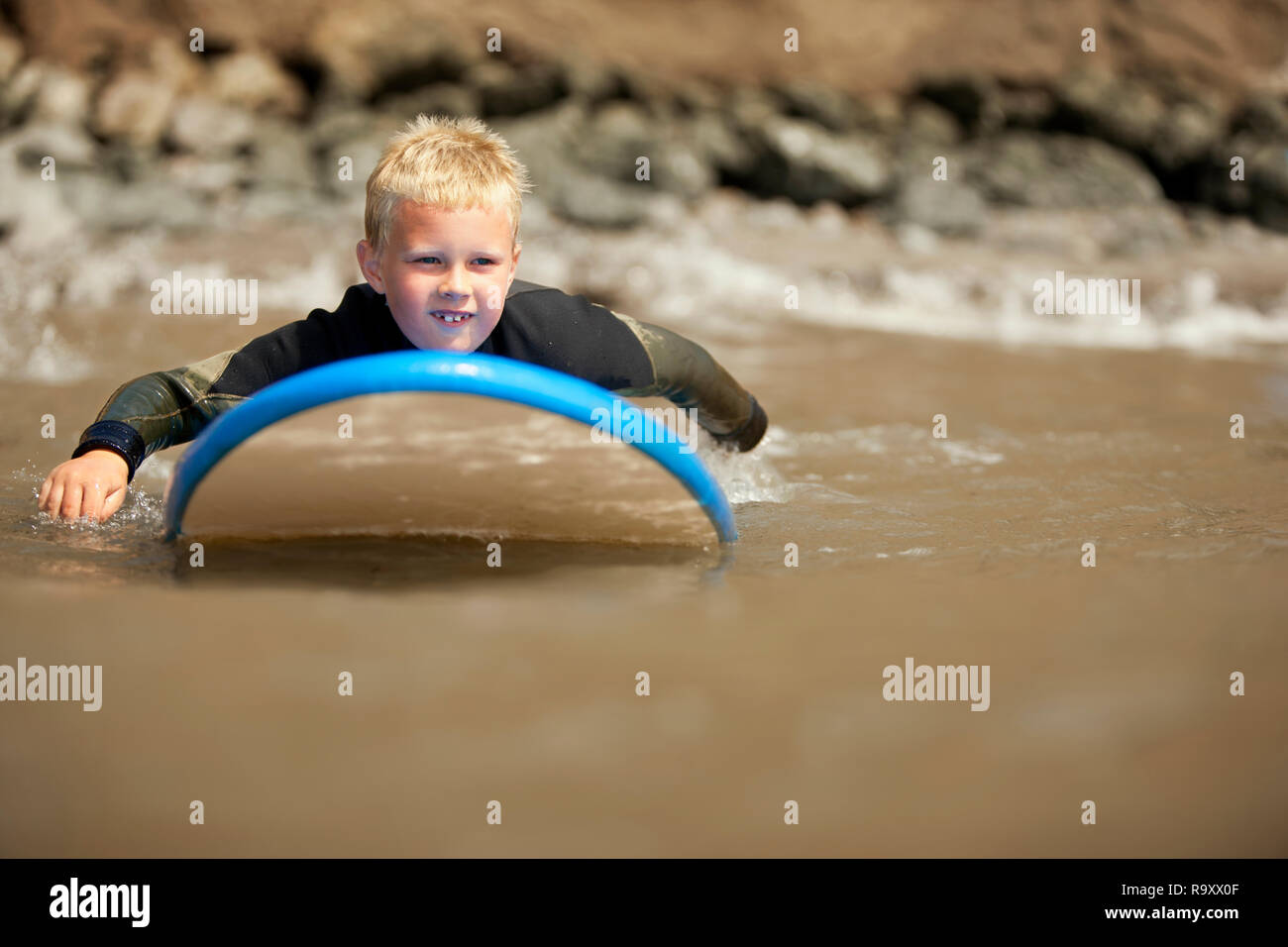 Kids wetsuits hi-res stock photography and images - Alamy