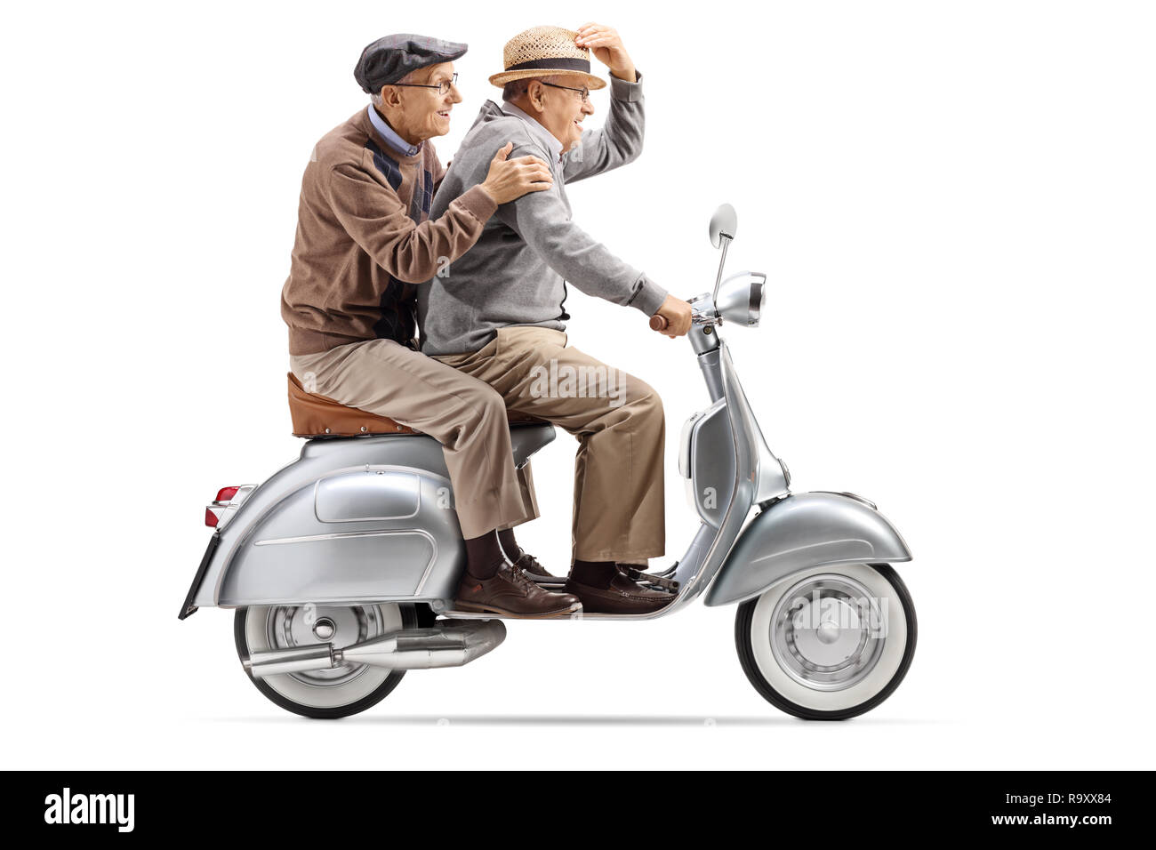 Full length shot of two senior men riding a vintage scooter fast ...