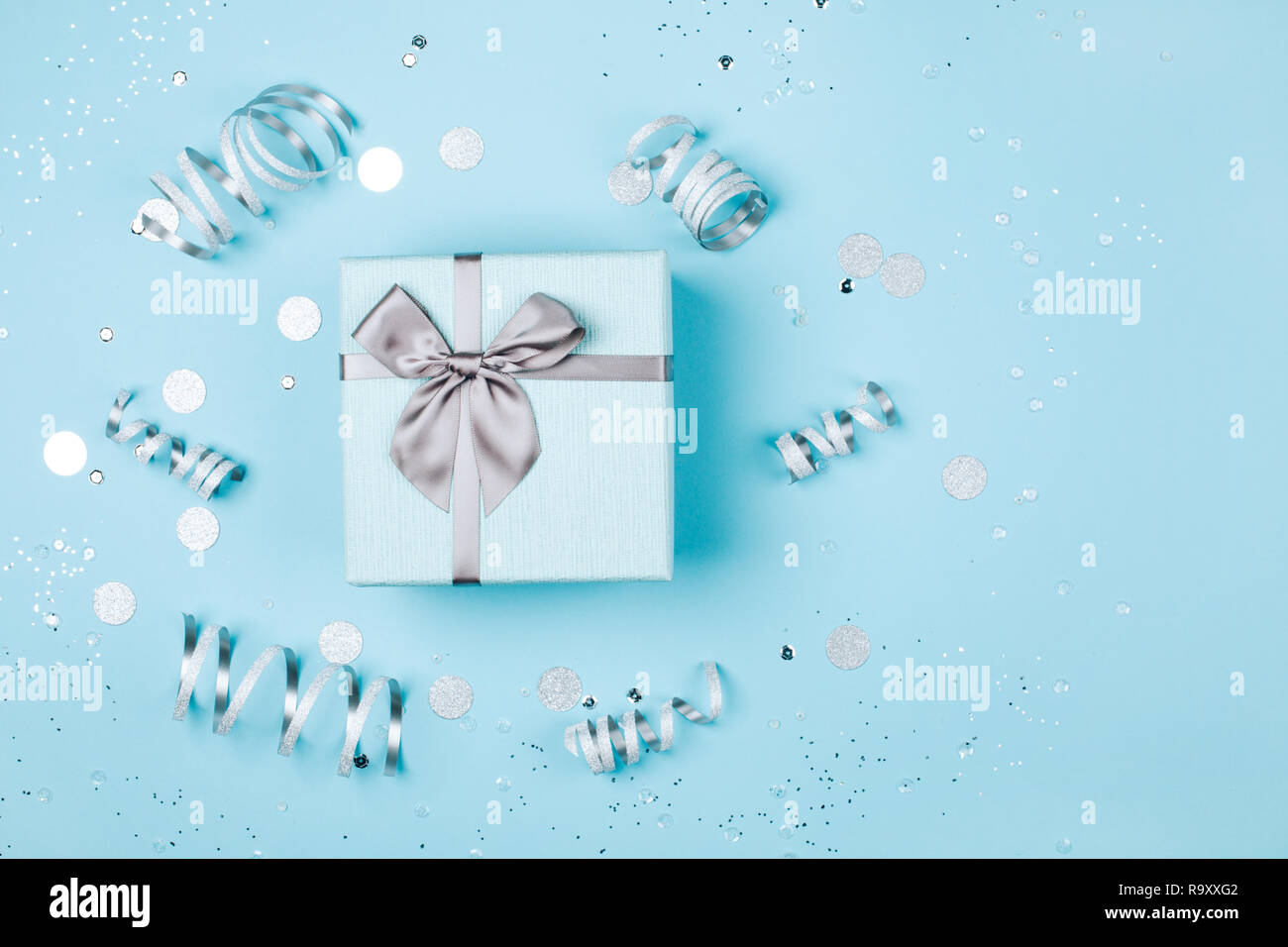 Blue present box on trendy pastel background. Flat lay style Stock ...