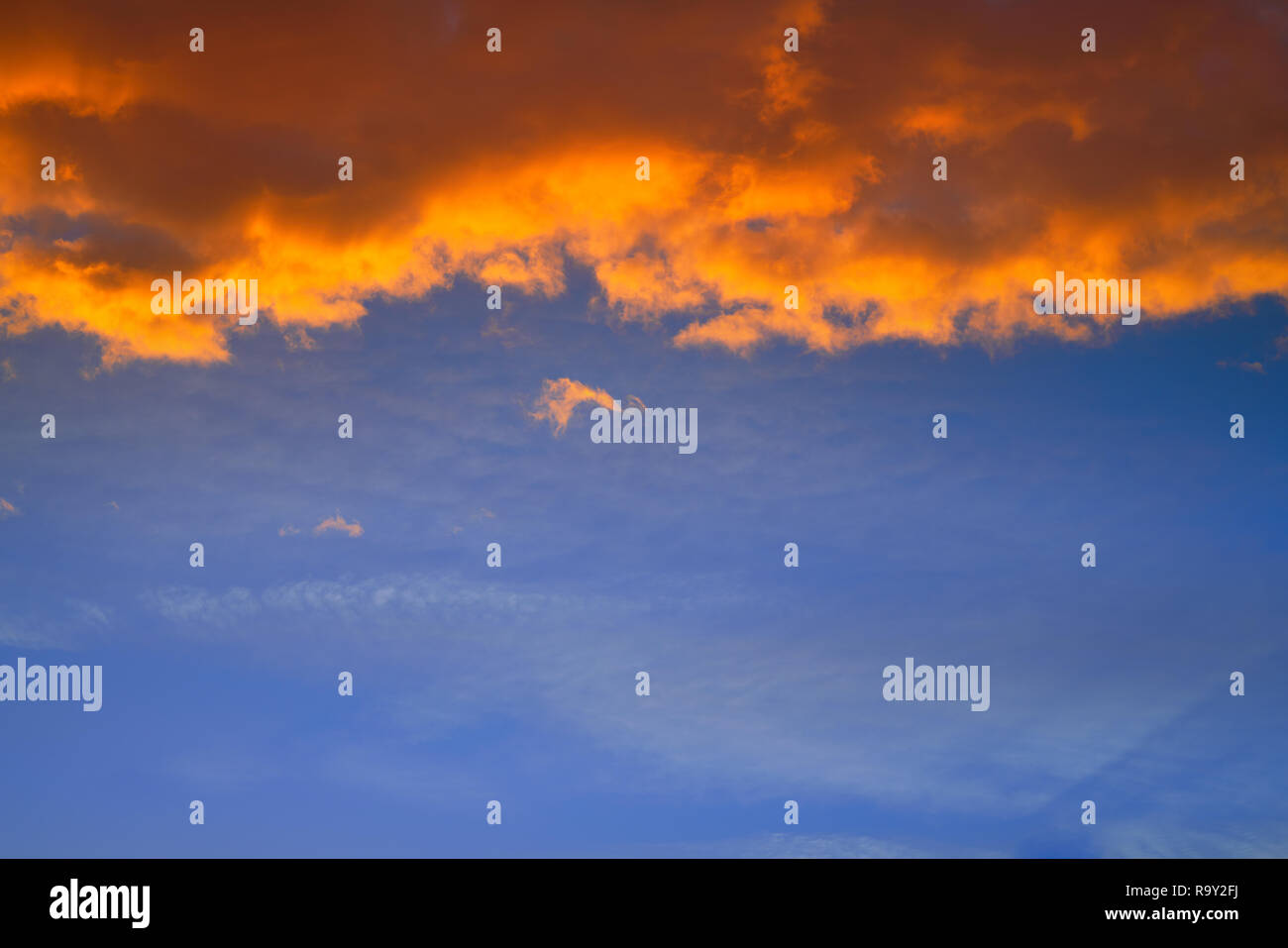 Sunset sky clouds orange and blue colors Stock Photo - Alamy