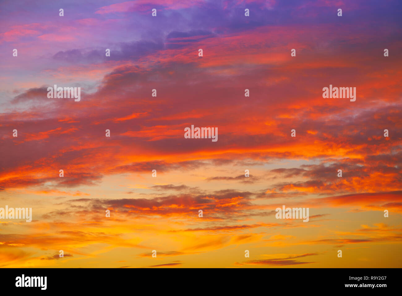 Sunset sky clouds orange and blue colors Stock Photo - Alamy