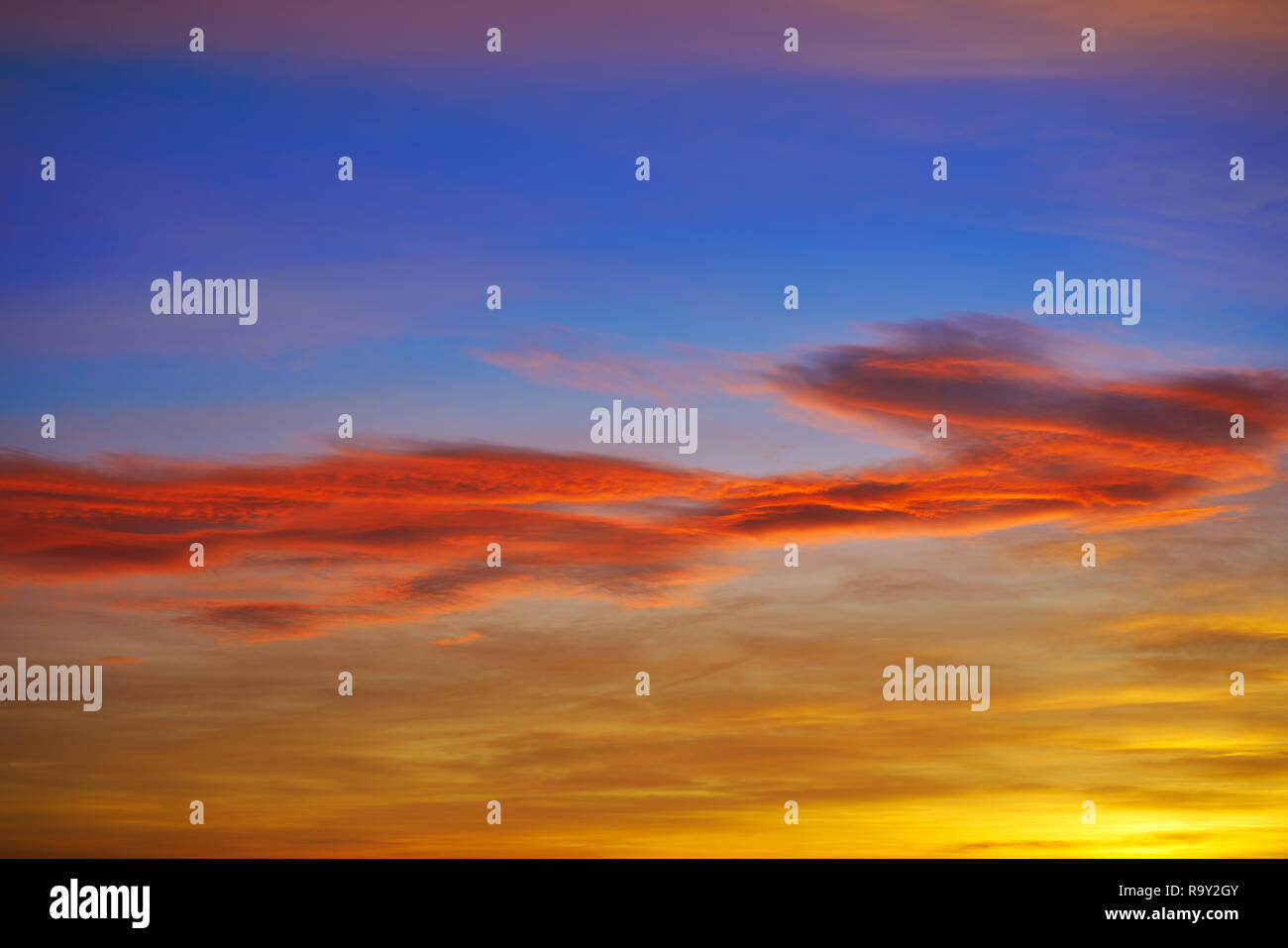 Sunset sky clouds orange and blue colors Stock Photo - Alamy