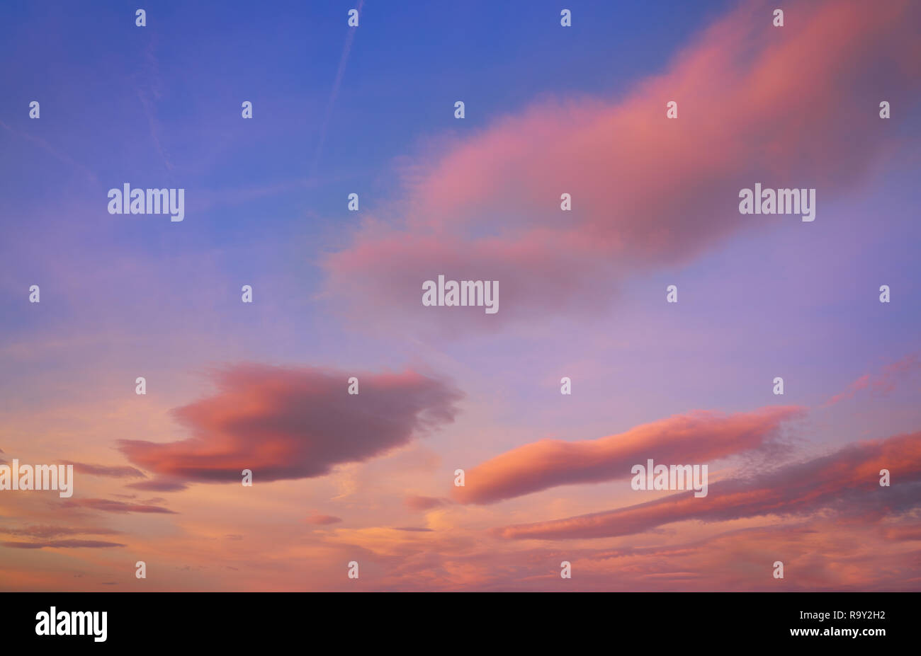 Sunset sky clouds orange and blue colors Stock Photo - Alamy