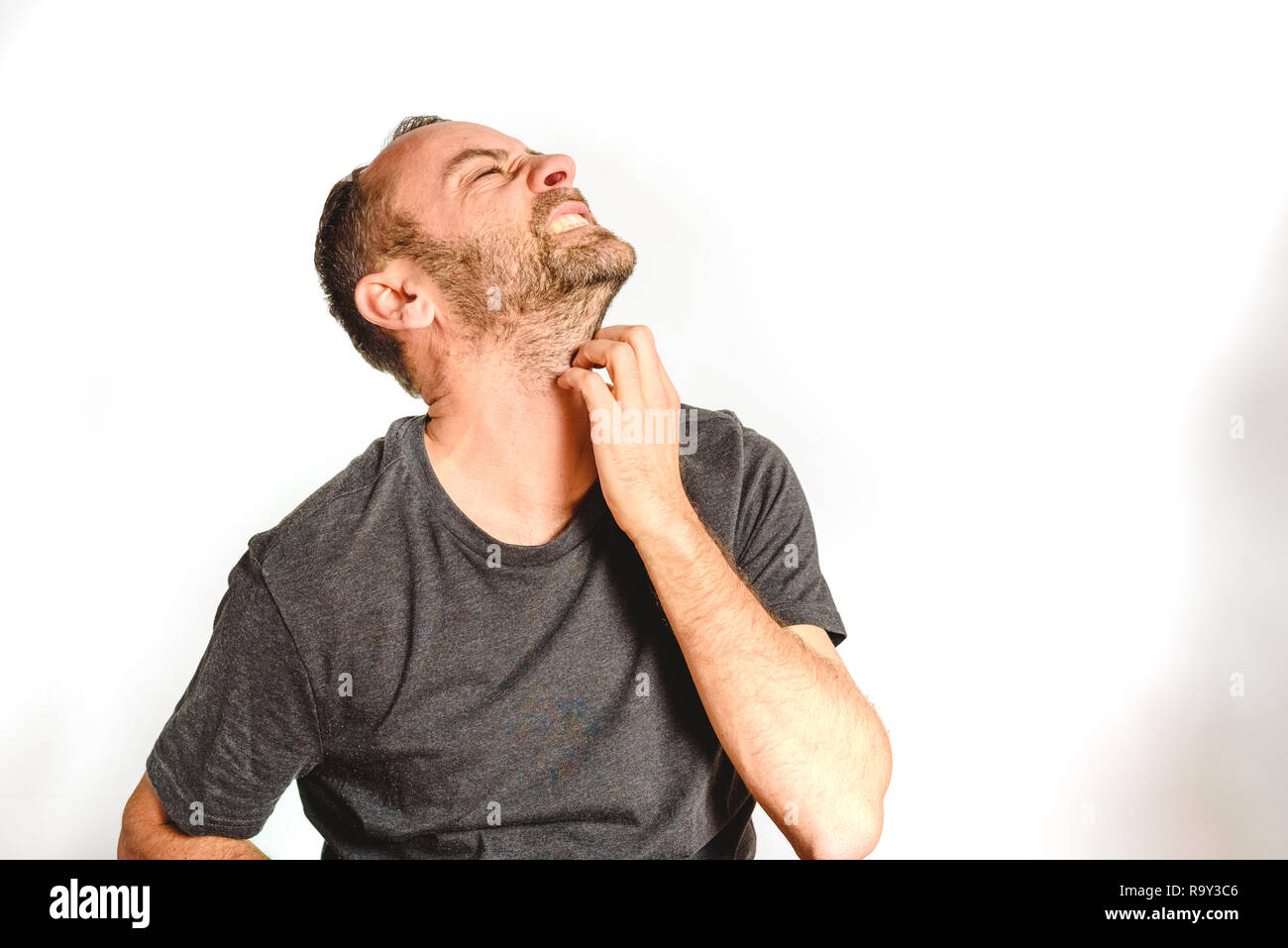 Man in studio overwhelmed, stressed and surprised, model expressions ...