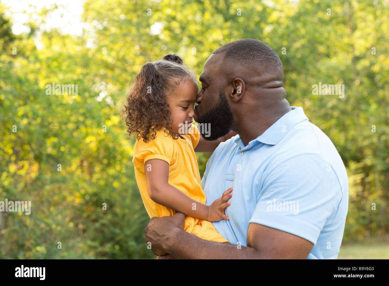 Father laughing and playing with his daugher Stock Photo - Alamy