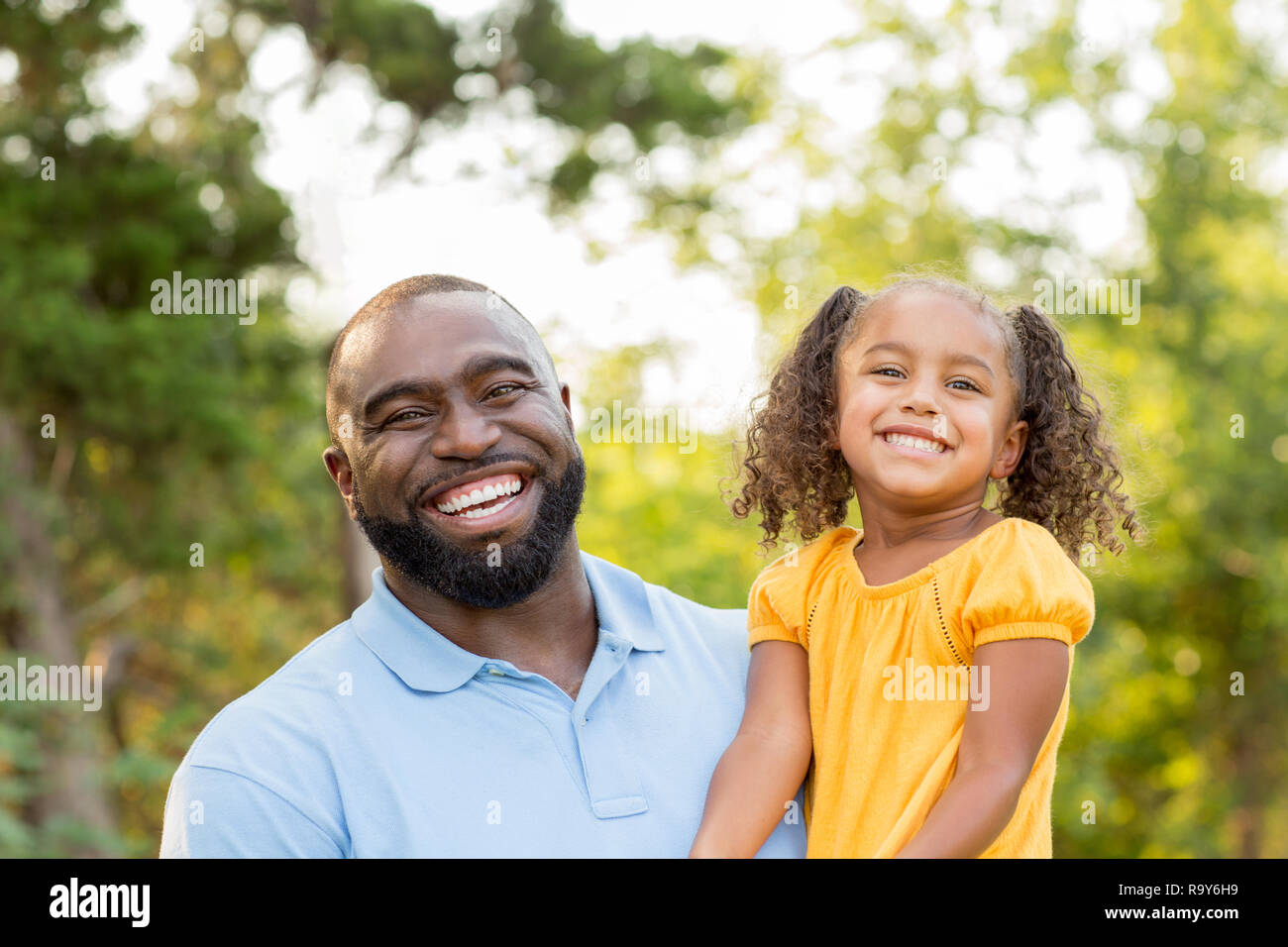 Father laughing and playing with his daugher Stock Photo - Alamy
