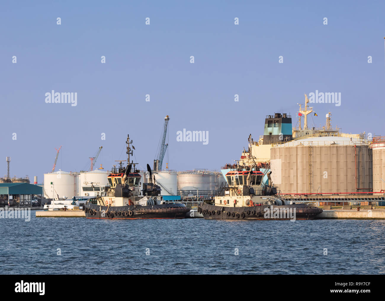 Tugs moored at an oil refinery, Port of Antwerp, Belgium Stock Photo ...