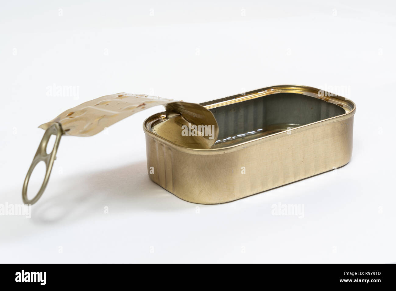 an empty tin of fish in oil Stock Photo - Alamy