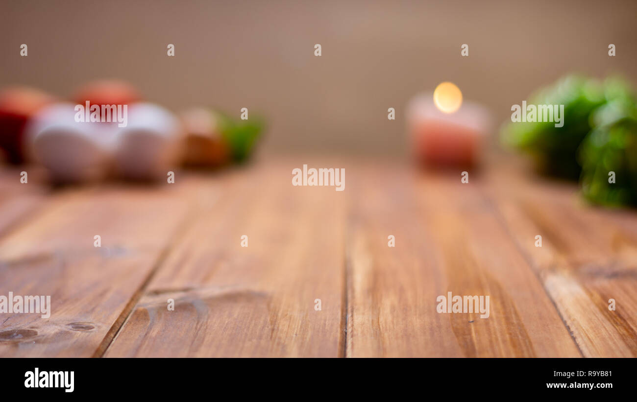Rustic kitchen table, in the background some foods out of focus ...