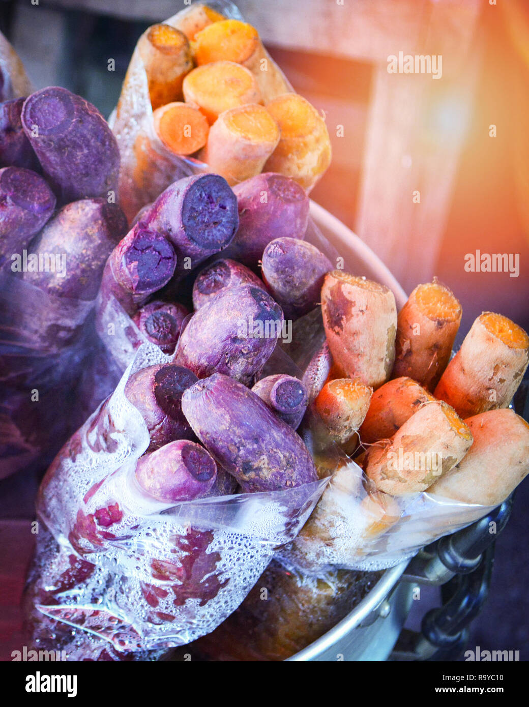 steamed yam sweet potato / purple and yellow yams on Steamer in street ...