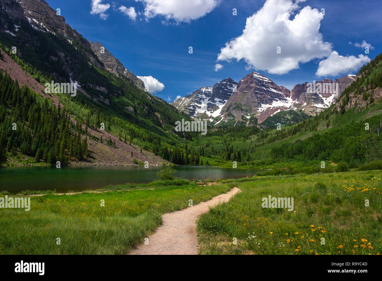 Stunning Maroon Bells peaks and trail leading to Maroon Lake in summer ...