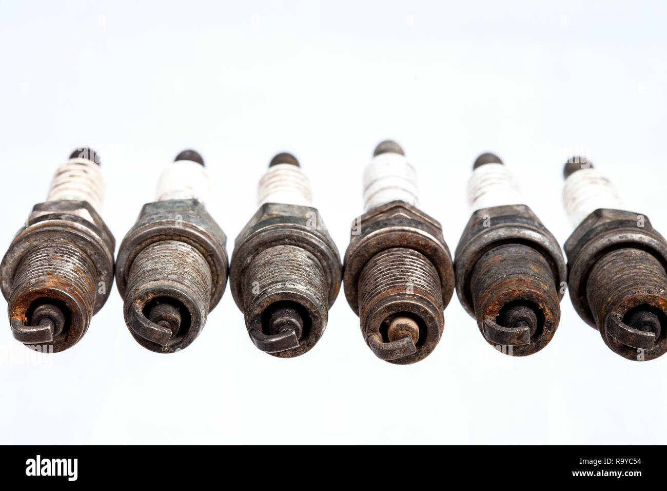 Heavily worn spark plugs isolated on white Stock Photo - Alamy